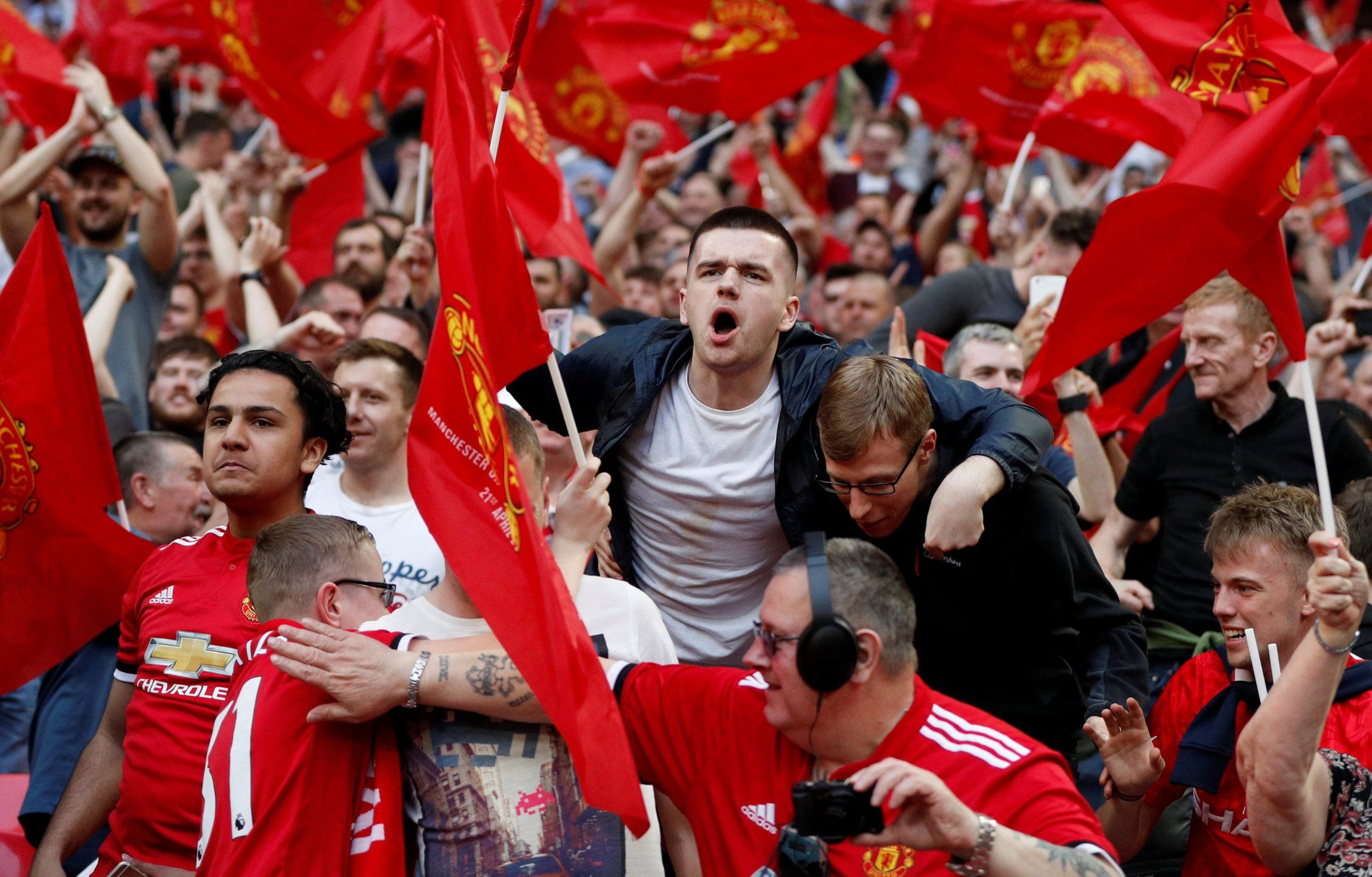 Man United fans mock City for the turnout at their title bus parade